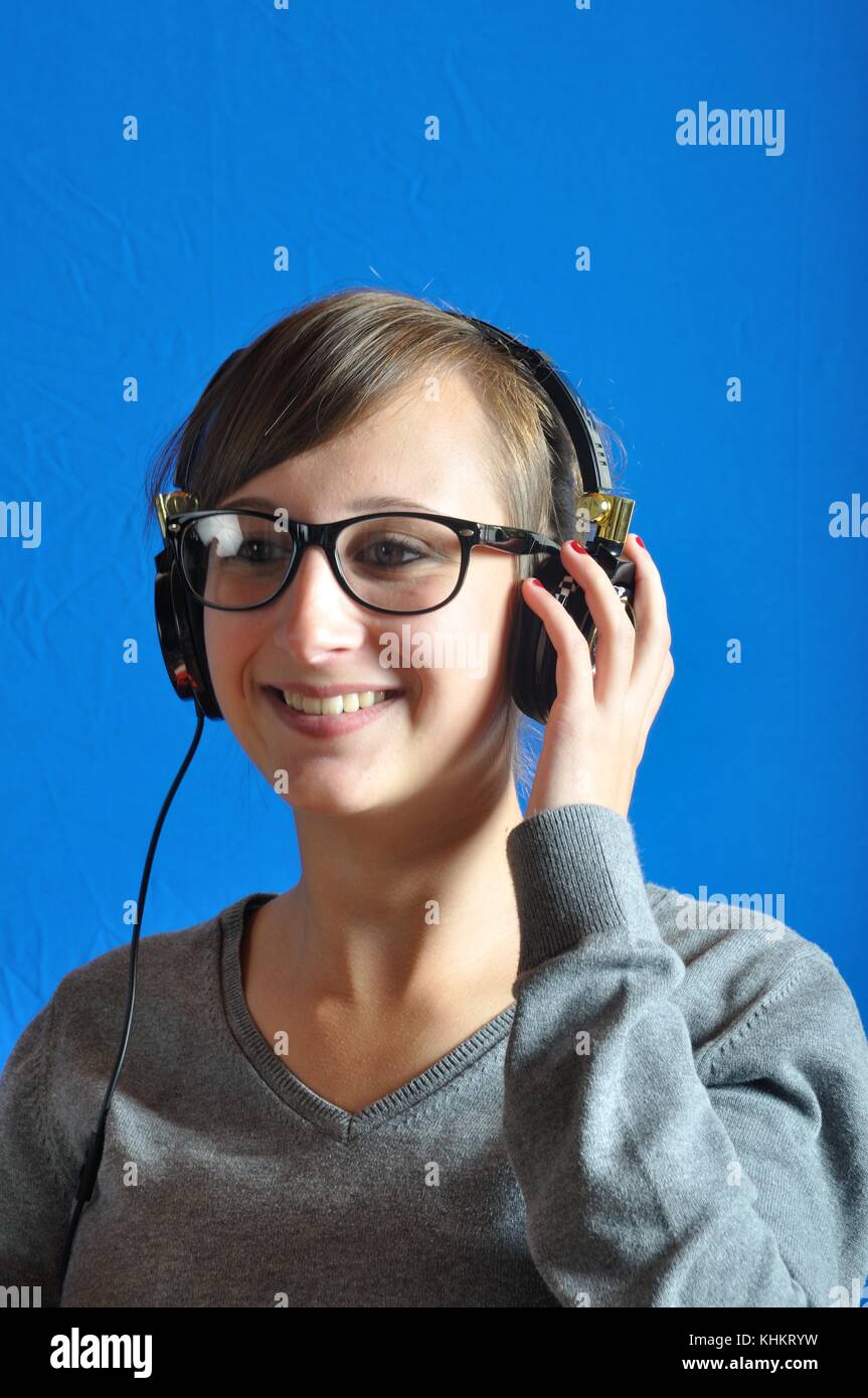 Teen listening to music Stock Photo - Alamy