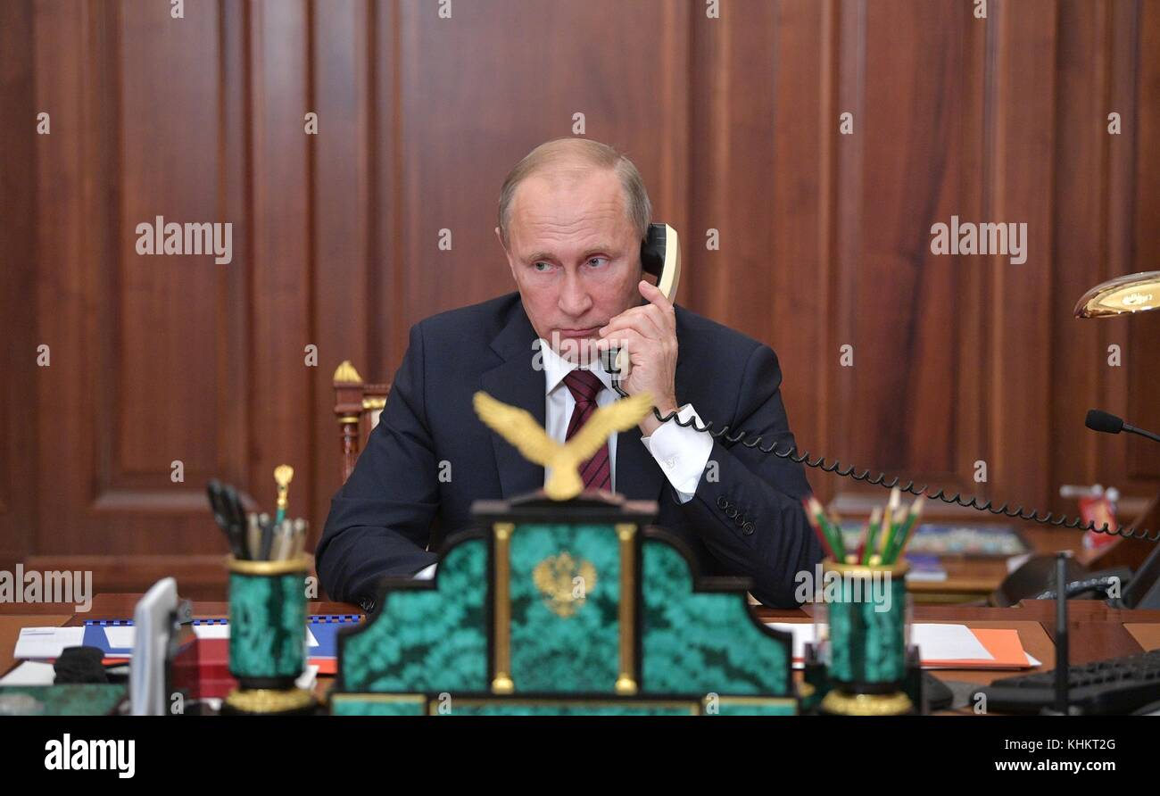 Russian President Vladimir Putin speaks by telephone with Head of the ...