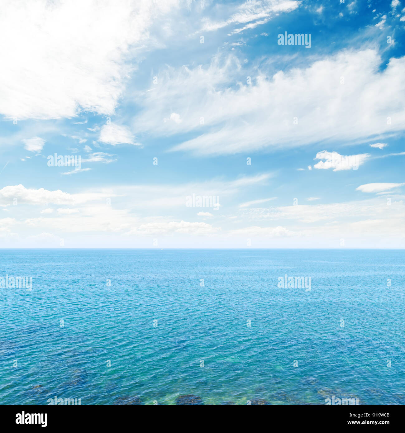 clouds in blue sky over sea Stock Photo - Alamy