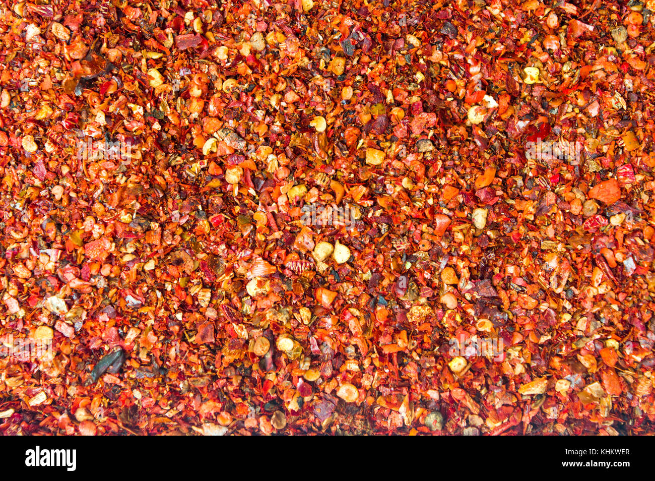 Grounded red pepper on a pile background pattern Stock Photo - Alamy