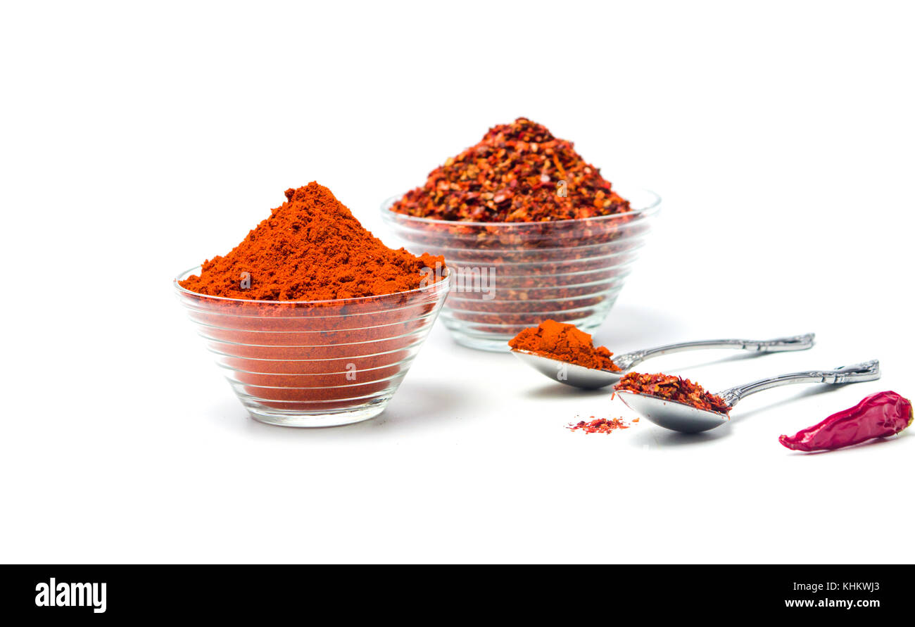 Smashed and ground ed pepper powder in a glass bowl isolated Stock ...