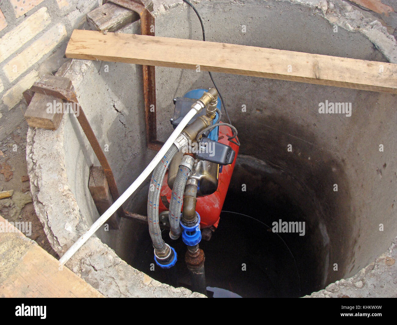 NICA, LATVIA - JULY 24, 2016: Automatic electric pump is mounted inside ...