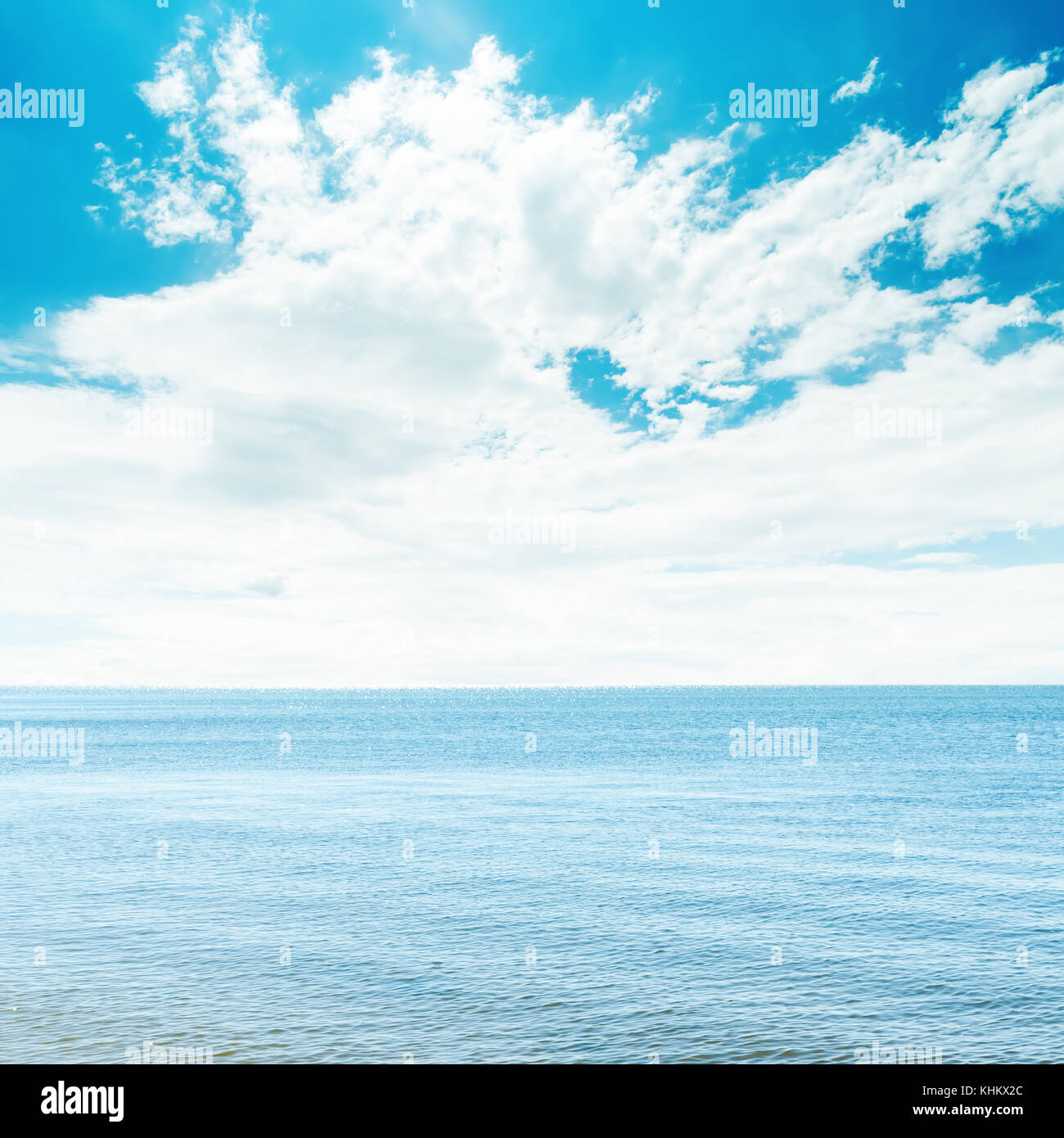 blue sea and white clouds in sky over it Stock Photo - Alamy