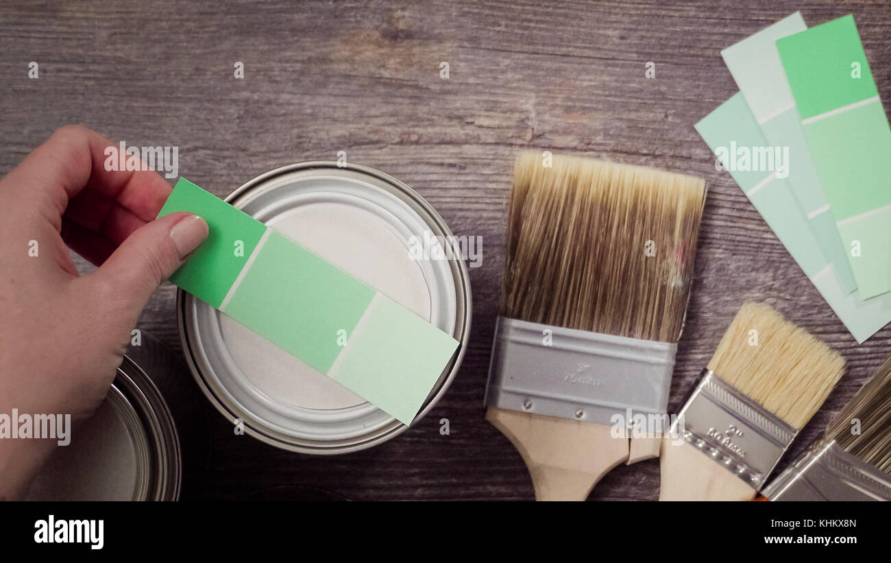 Home inprovement project. Painting wood with turquose color paint Stock ...