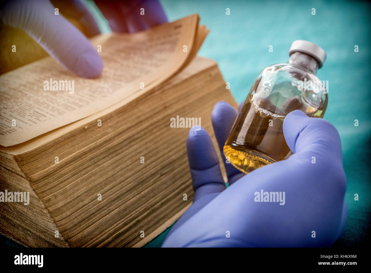 Doctor reading book of old medicine, conceptual image Stock Photo - Alamy