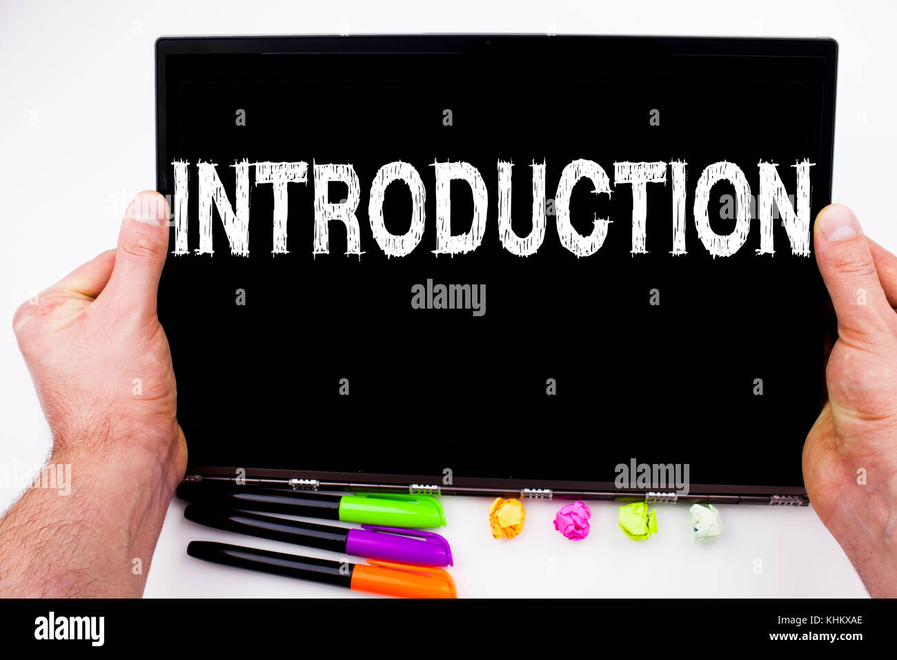 Introduction text written on tablet, computer in the office with marker ...