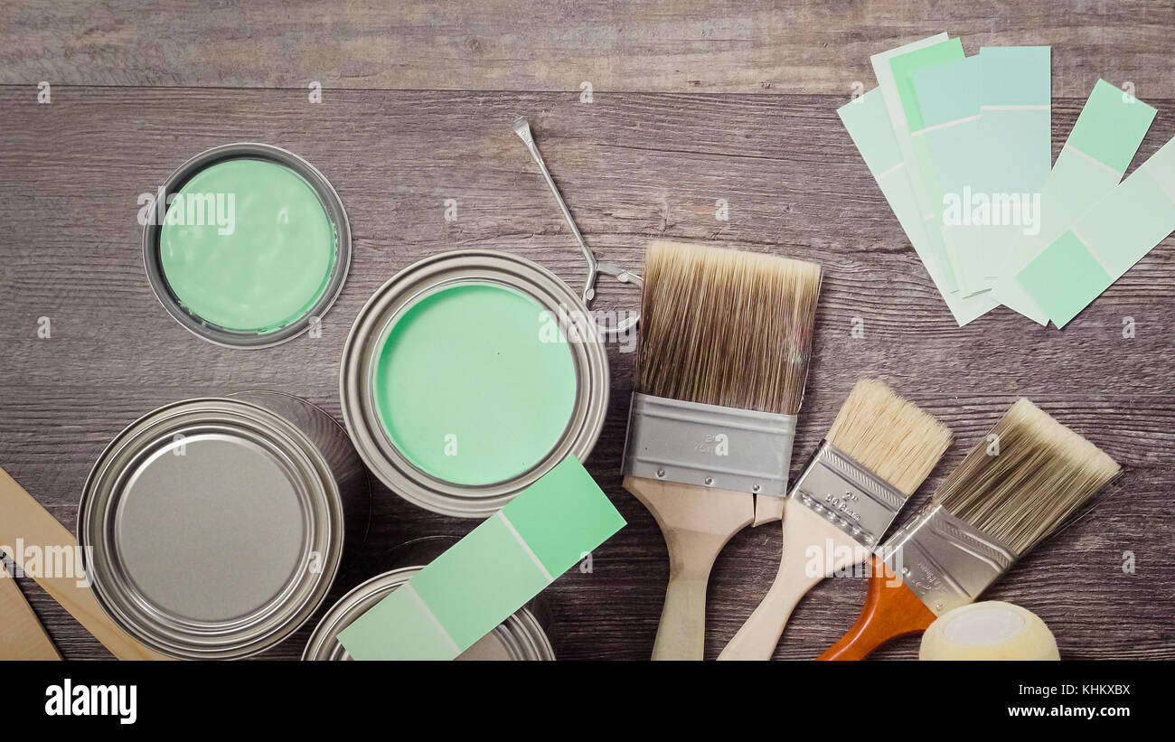 Home inprovement project. Painting wood with turquose color paint Stock ...