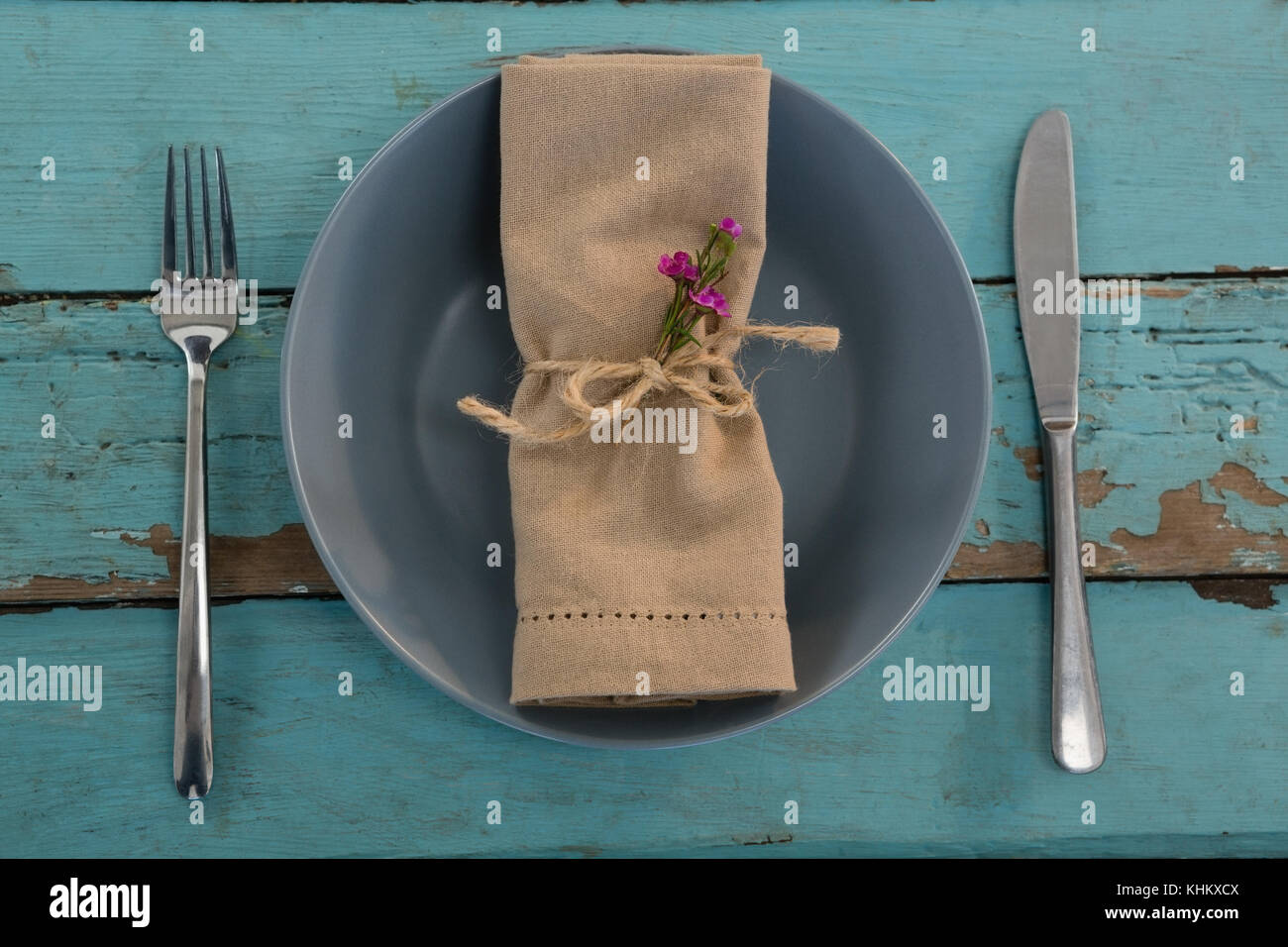 Overhead of table setting on weathered wooden plank Stock Photo - Alamy