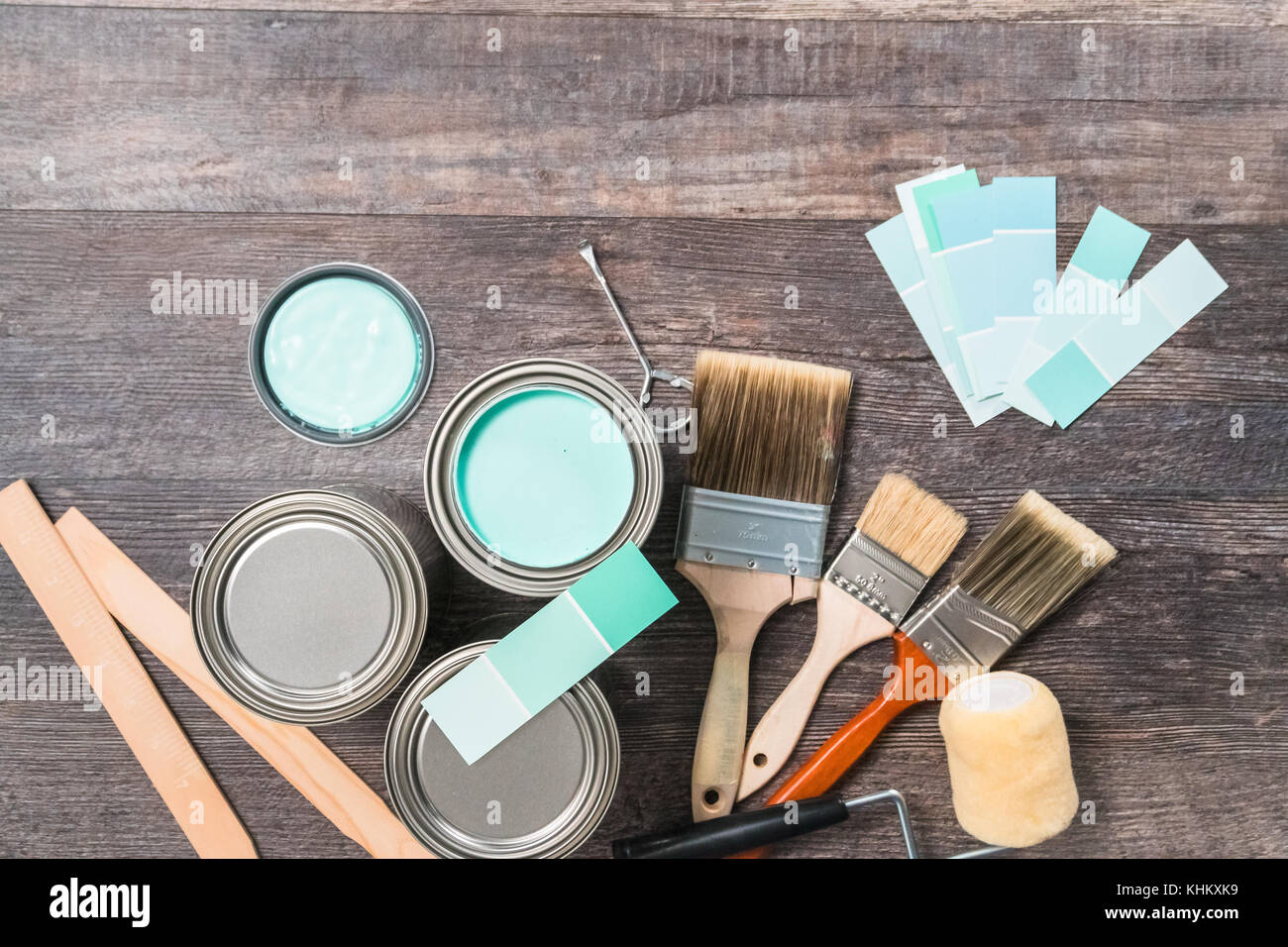 Home inprovement project. Painting wood with turquose color paint Stock ...