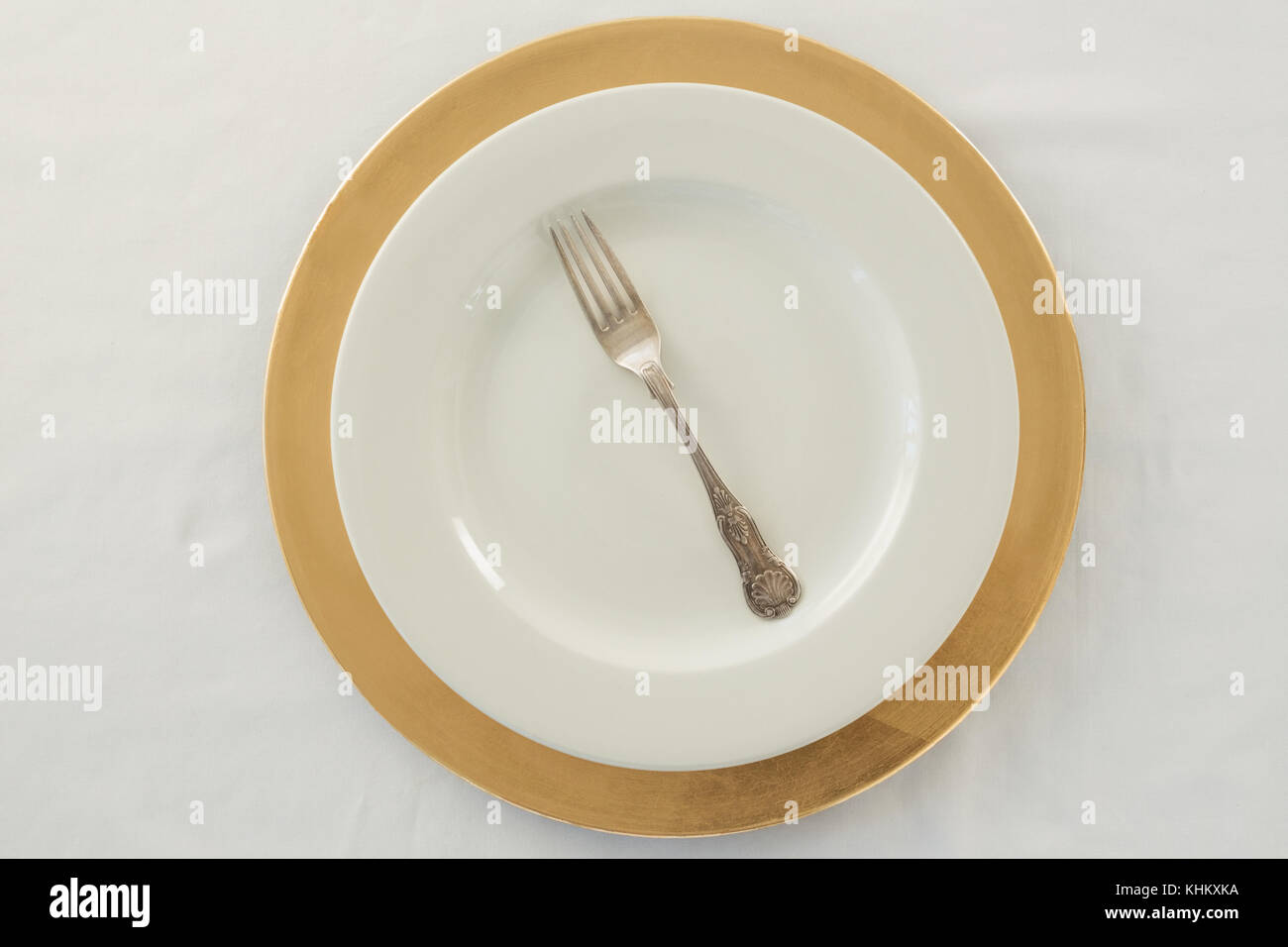 Close-up of fork in a plate Stock Photo - Alamy