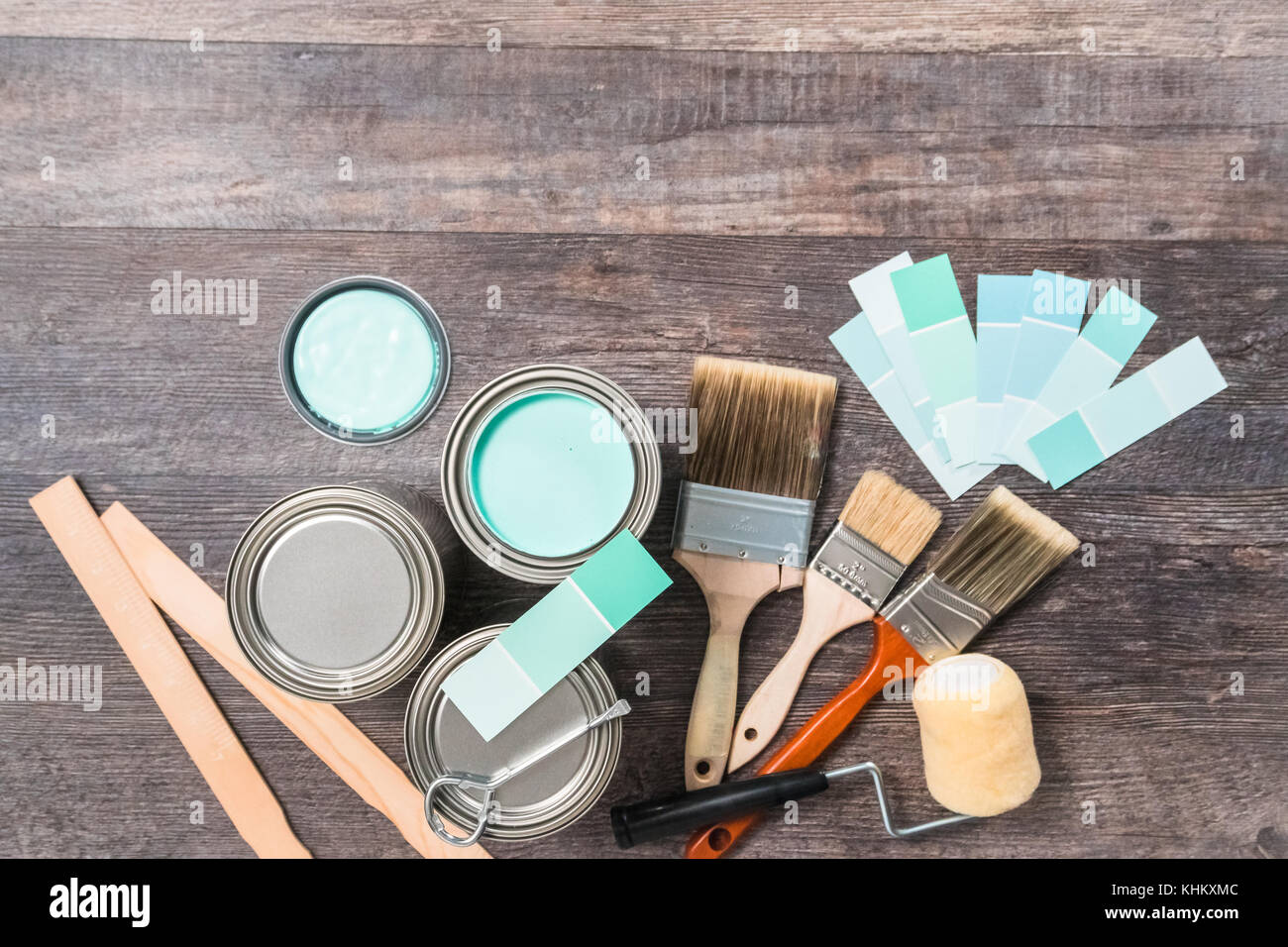 Home inprovement project. Painting wood with turquose color paint Stock ...