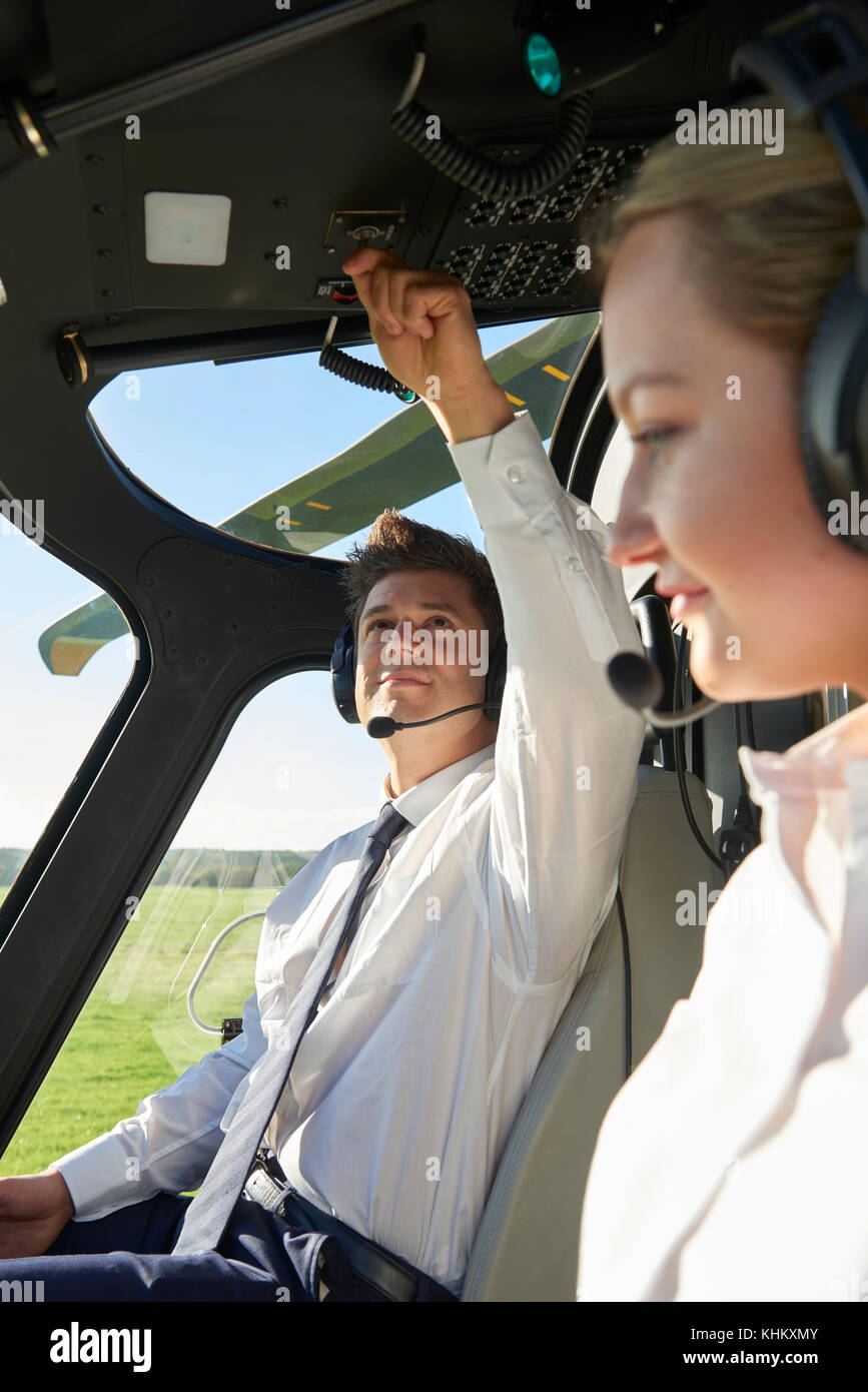 Pilot And Co Pilot In Cockpit Of Helicopter Before Take Off Stock Photo ...