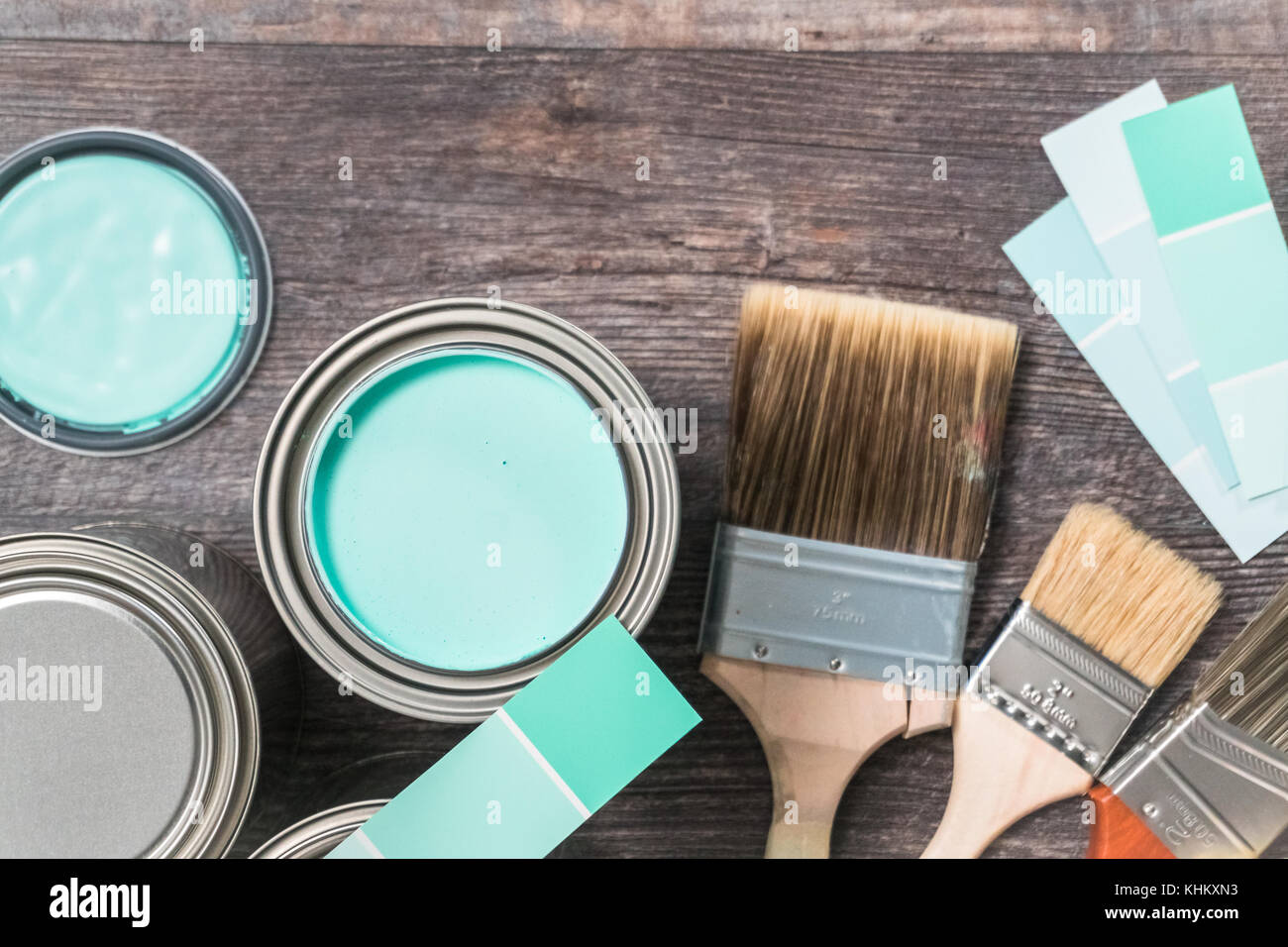 Home inprovement project. Painting wood with turquose color paint Stock ...