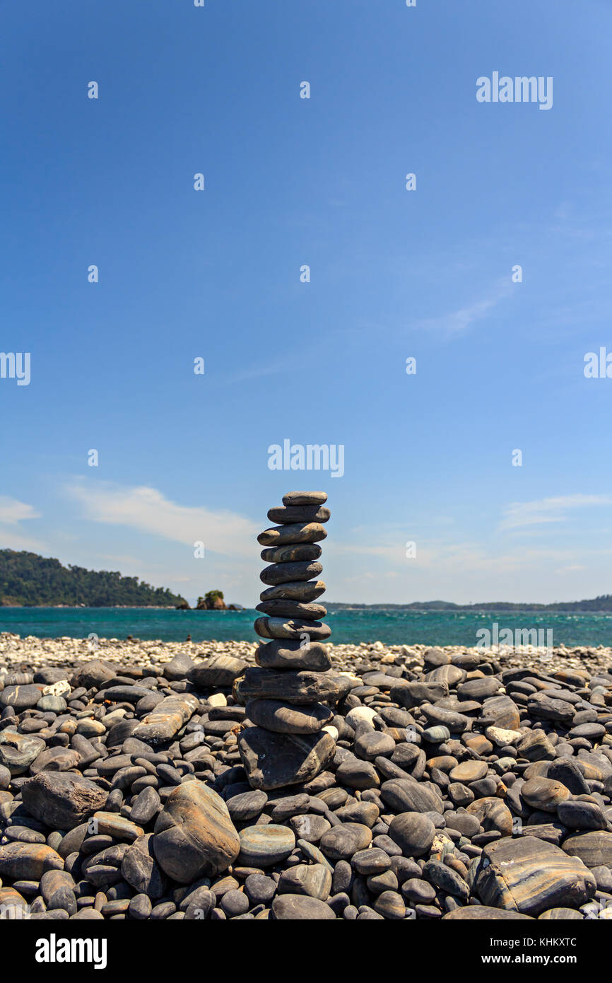 Stones on stack on the beach and blue sky Stock Photo - Alamy