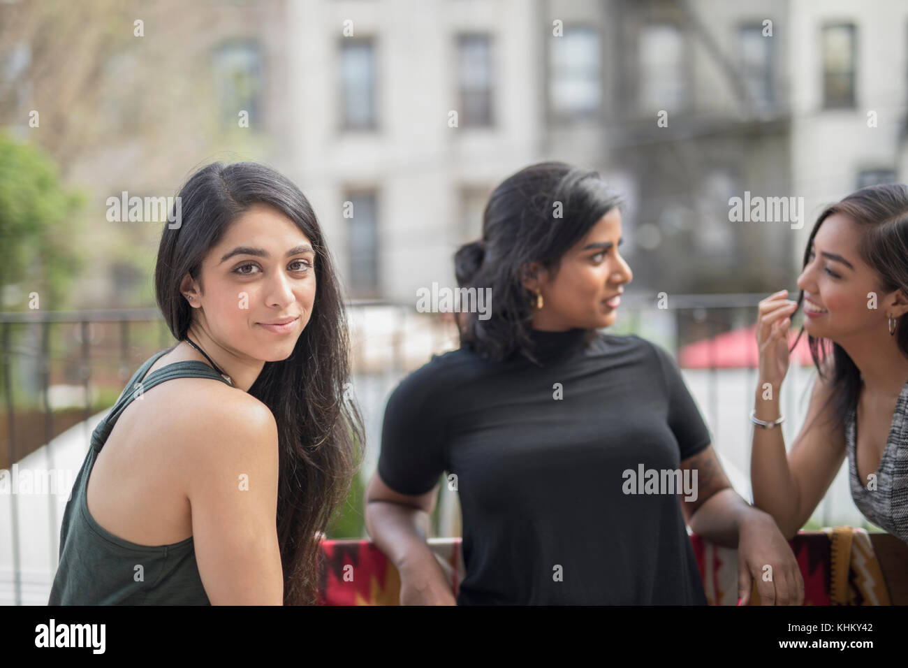 Young women talking at a party Stock Photo - Alamy