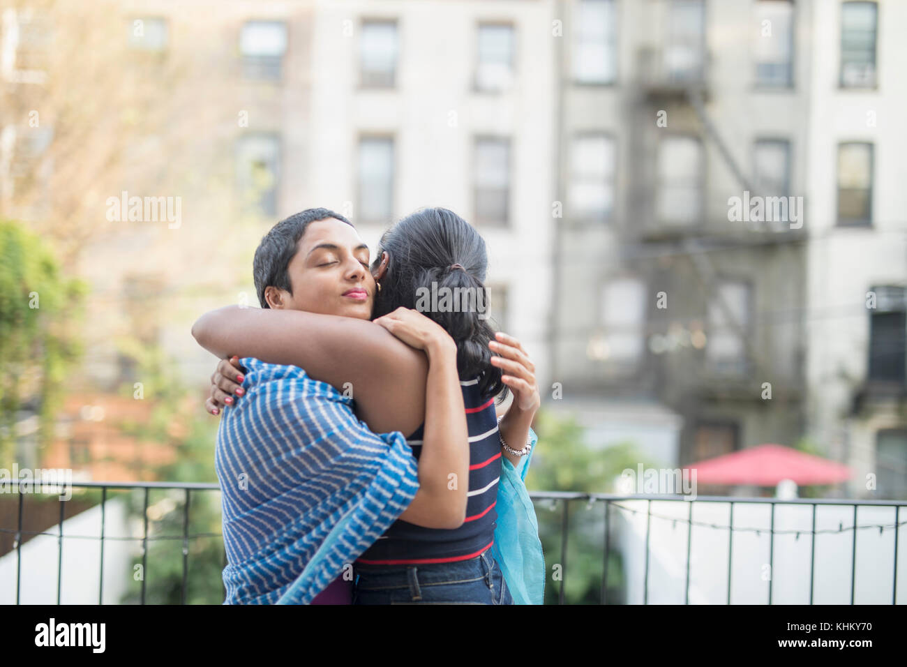 Diverse young women hugging hi-res stock photography and images - Alamy