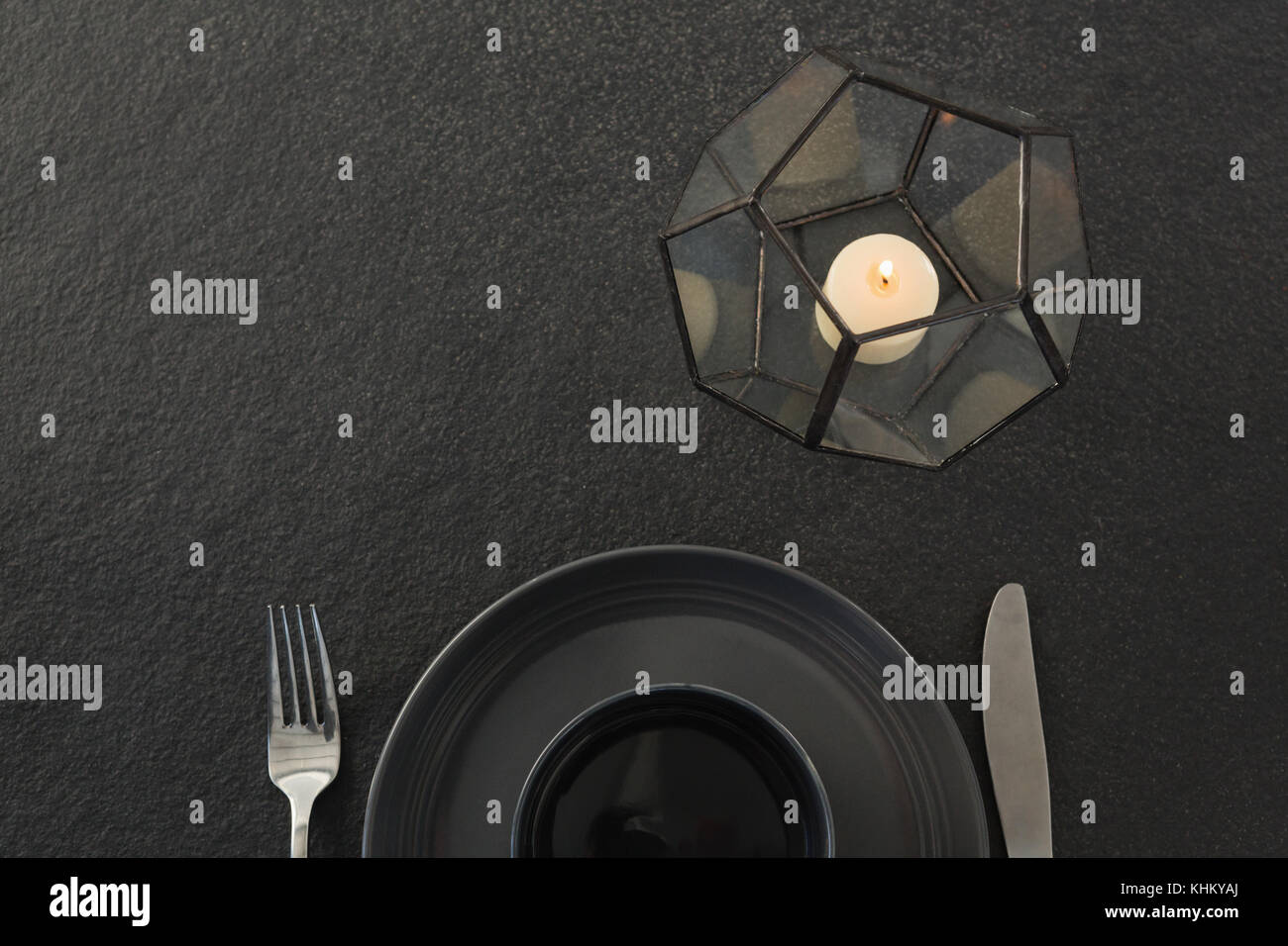 Close-up of black theme table setting Stock Photo - Alamy