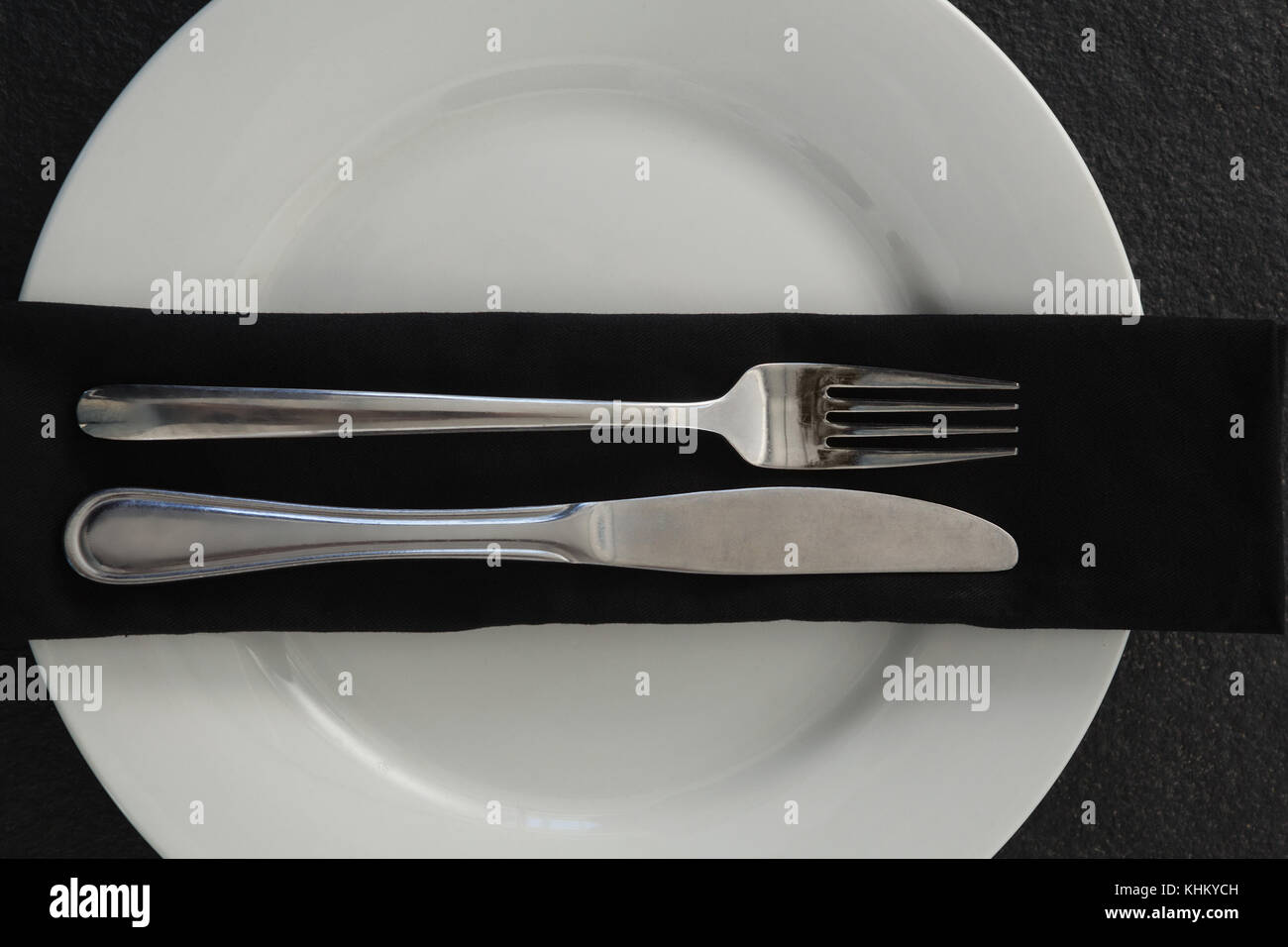 Close-up of plate and cutlery set on table Stock Photo - Alamy