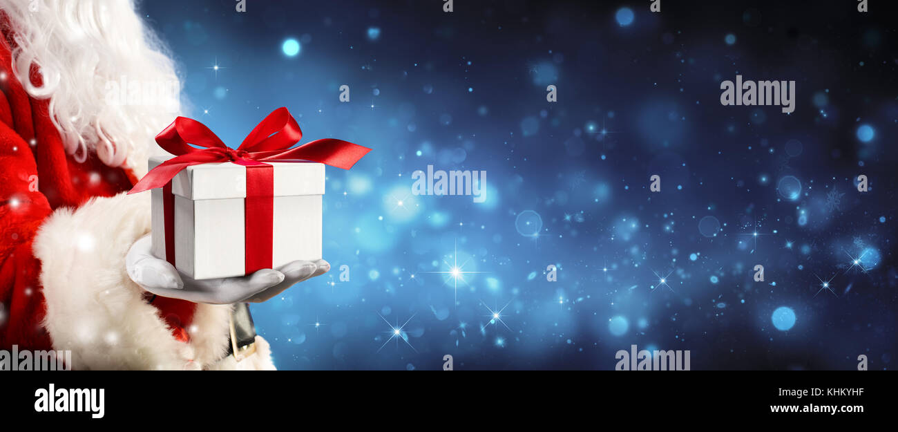 Santa claus giving gift hi-res stock photography and images - Alamy