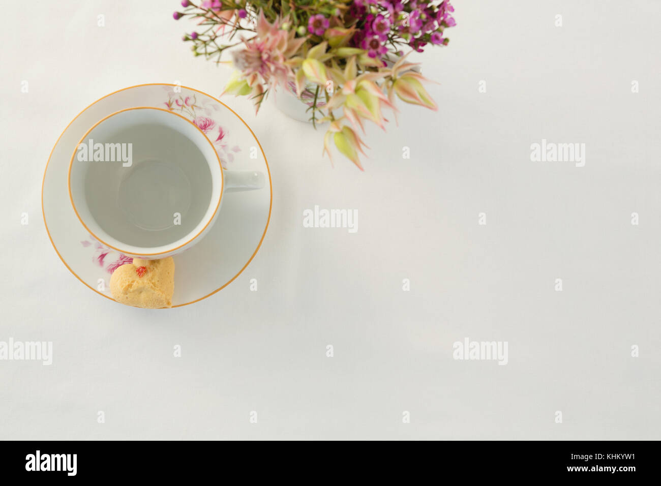Overhead view of empty cup and saucer with sweet food Stock Photo - Alamy