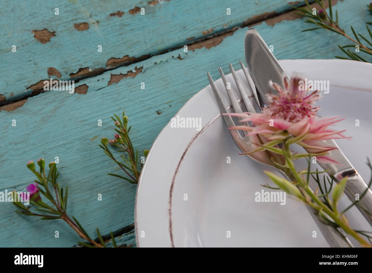 Close-up of cutlery with flower in a plate Stock Photo - Alamy