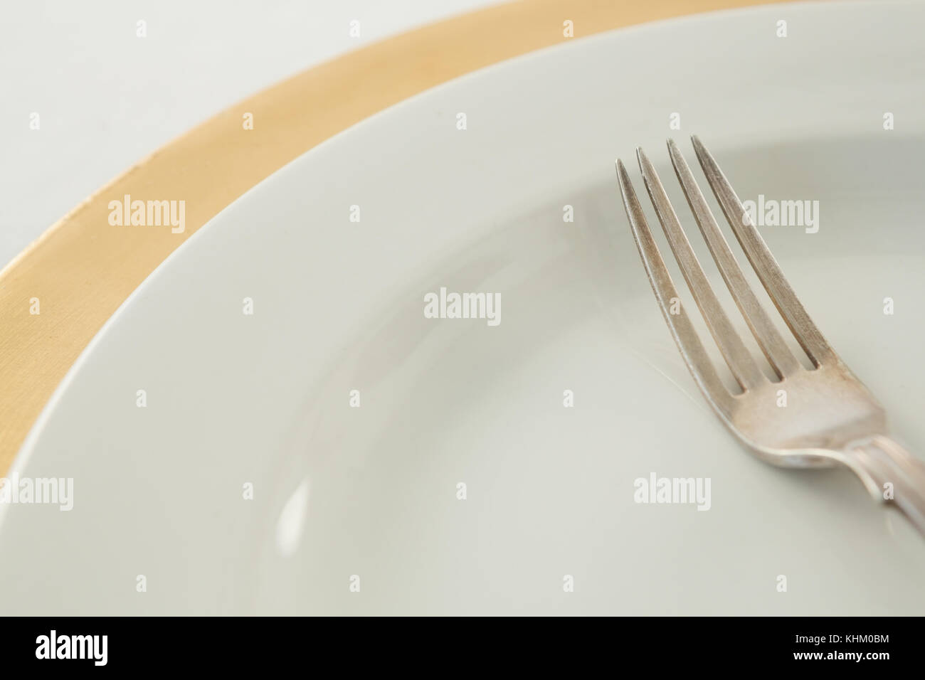 Extreme close-up of fork in a plate Stock Photo - Alamy