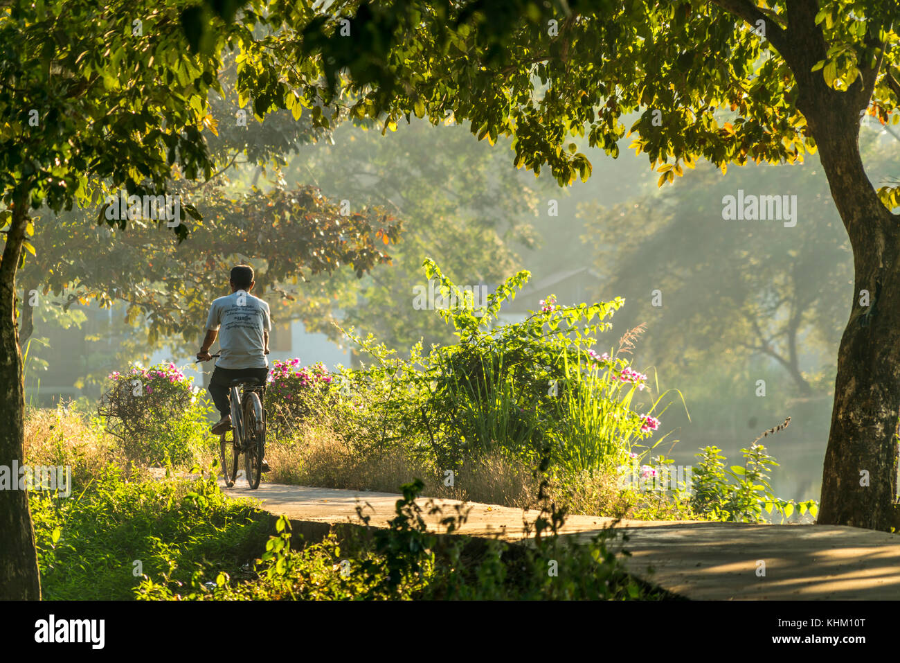Cyclist at Kan Thar Yar See, Hpa-an, Myanmar, Asia Stock Photo - Alamy