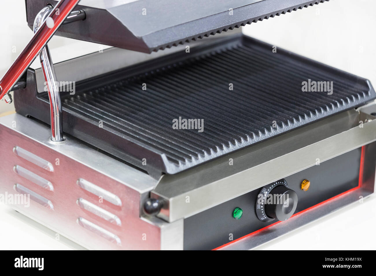 Electric grill for cooking food on a white background Stock Photo - Alamy