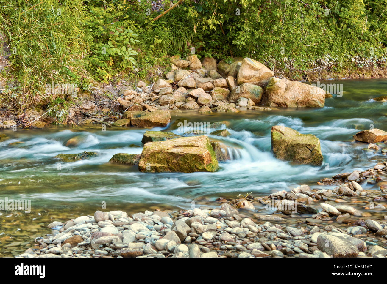 river waters flowing on rocks Stock Photo - Alamy