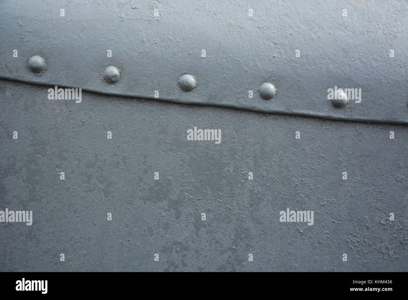Grey metal background with rivets. Closeup view Stock Photo - Alamy