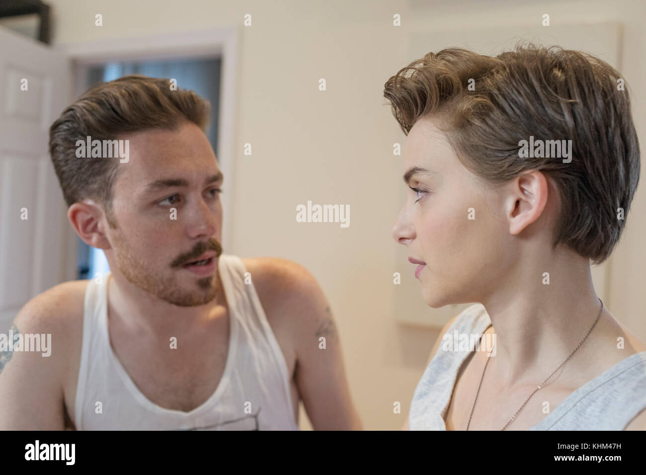 Young couple talking together Stock Photo - Alamy