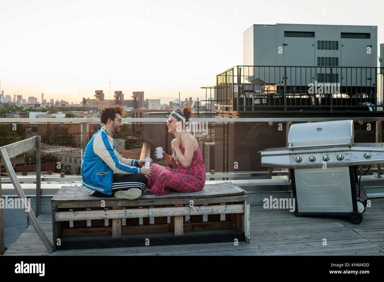 Man sitting on bench rooftop hi-res stock photography and images - Alamy