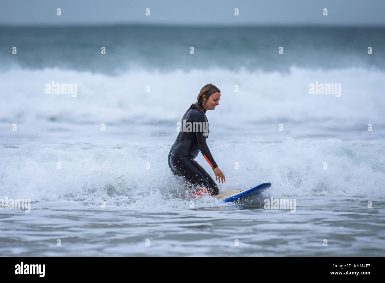 Young female surfing in Cornwall, england, UK Stock Photo - Alamy