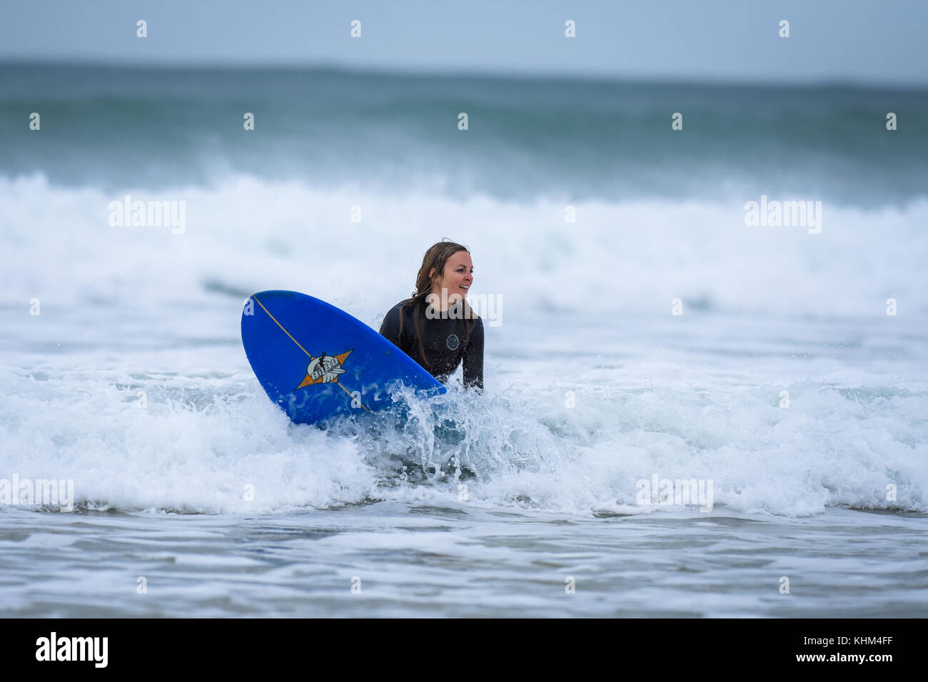 Young female surfing in Cornwall, england, UK Stock Photo - Alamy