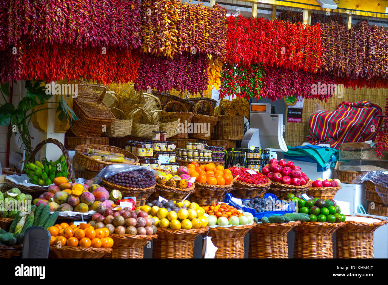 Colourful market stall with dried chilli peppers and exotic fruit at ...