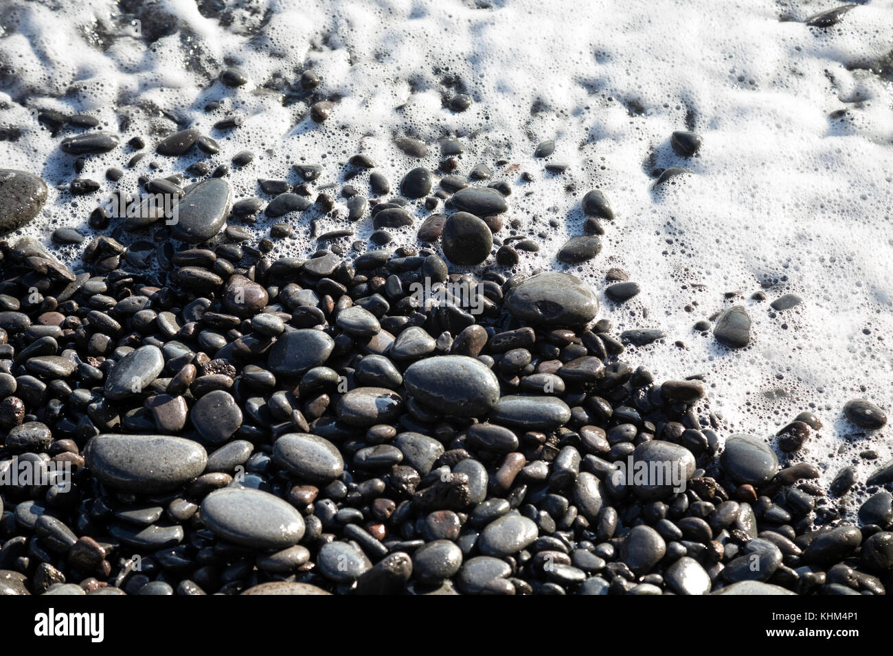 Volcanic rocky beach in Funchal, Madeira, Portugal Stock Photo - Alamy