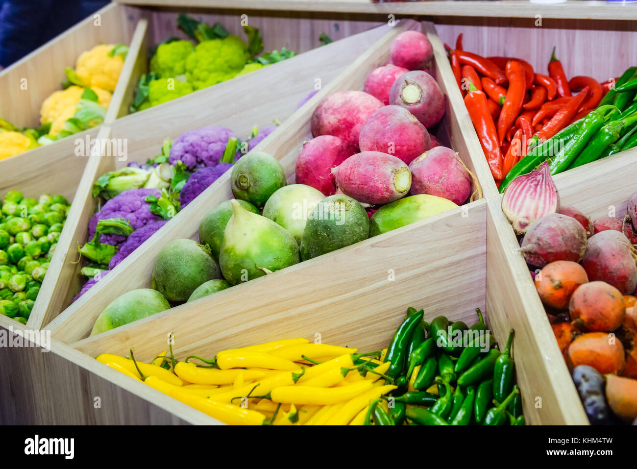 Assortment of fresh vegetables at market counter, vegetable shop ...