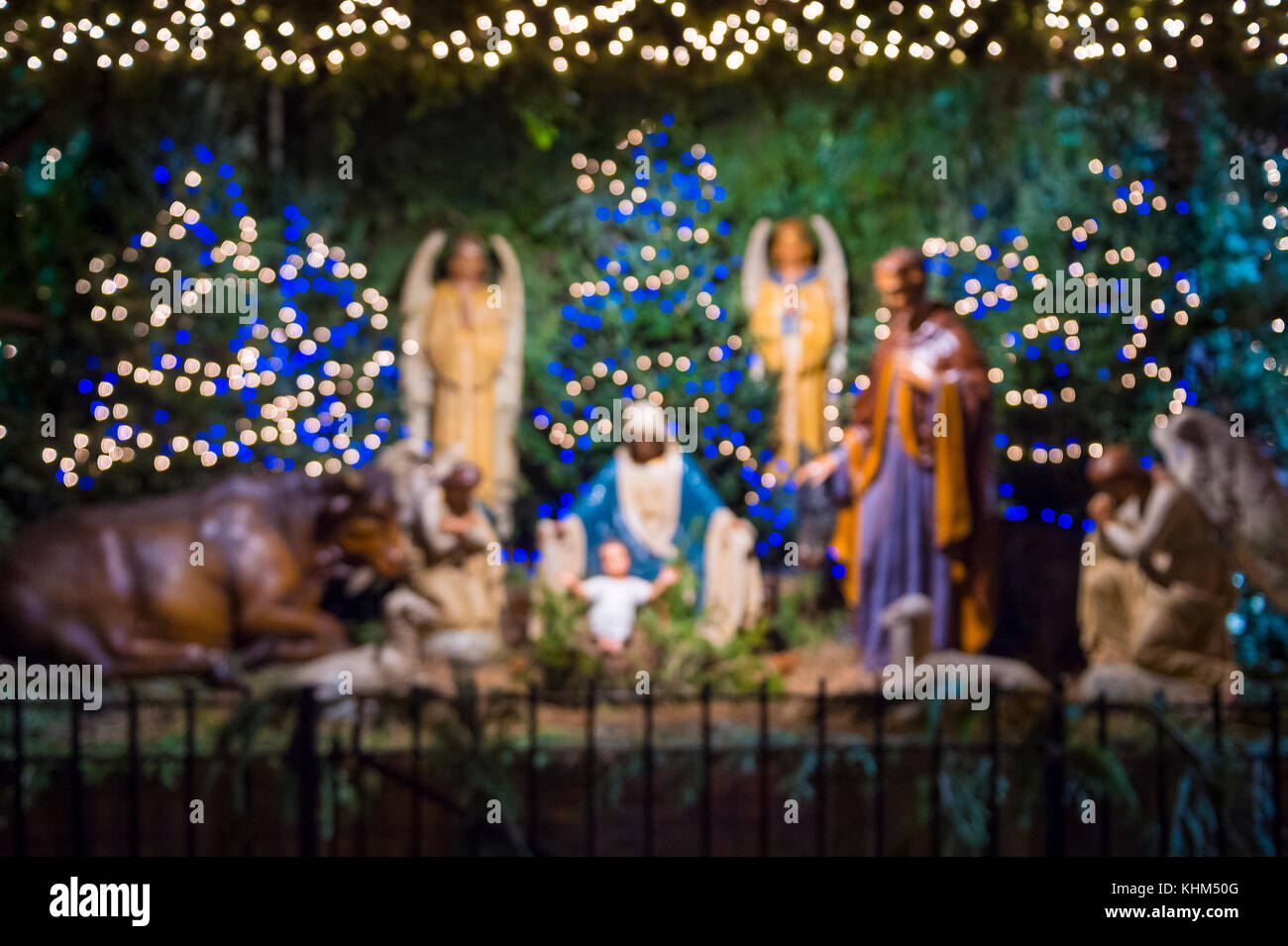 Defocused view of Christmas nativity scene with Mary, Joseph, and the ...