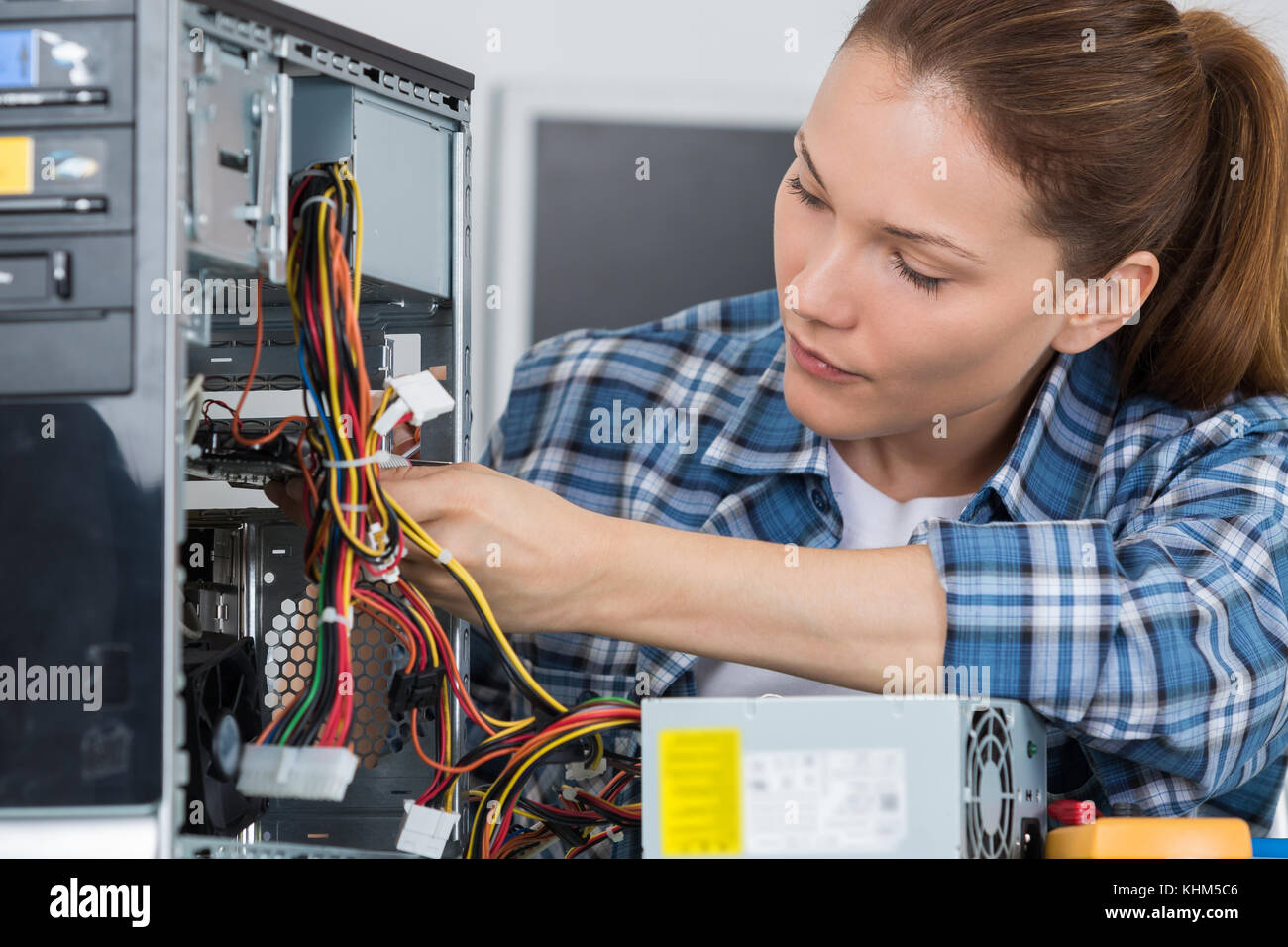 female tests electronic equipment Stock Photo - Alamy