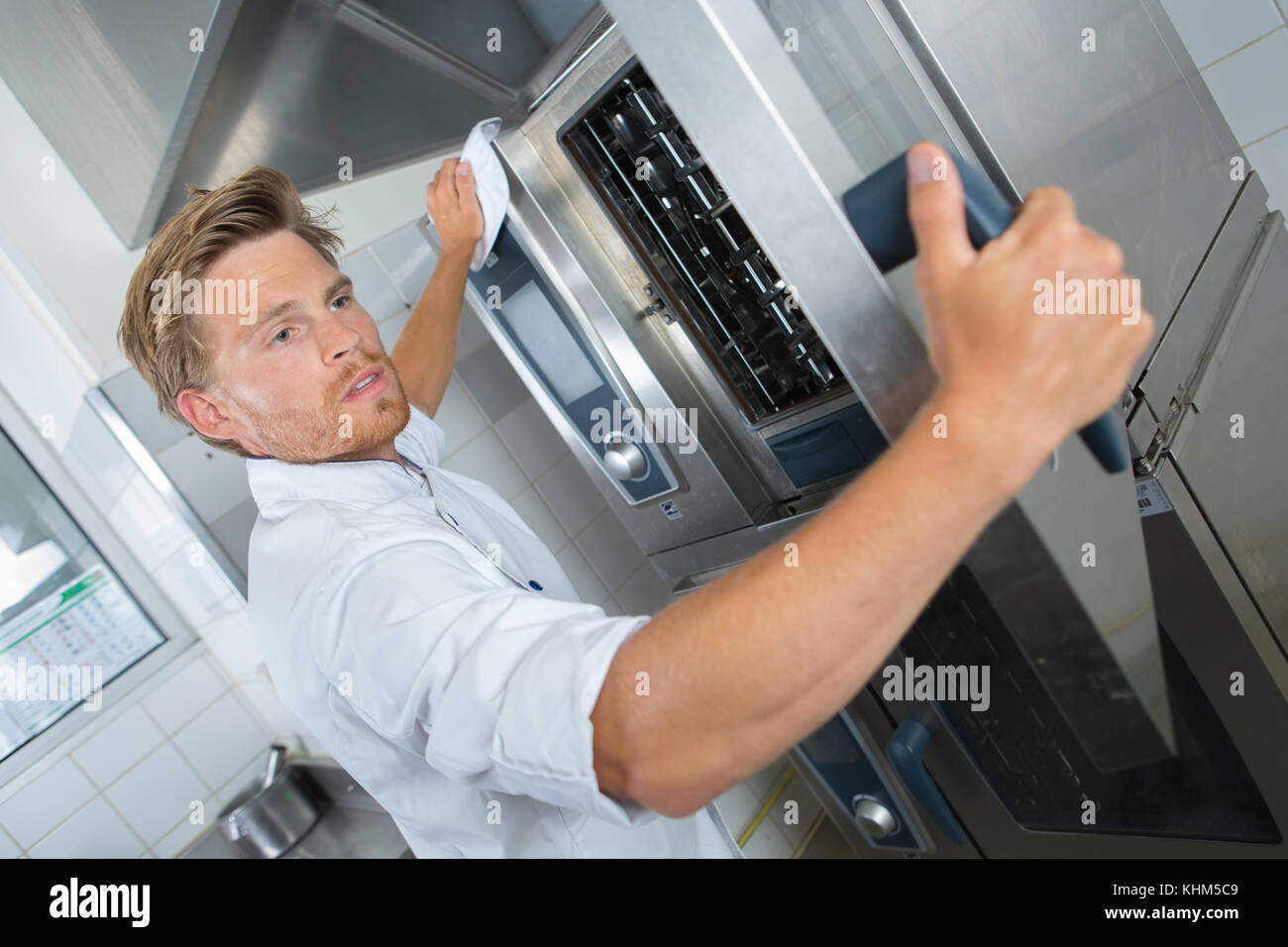 chef with a fridge in a professional kitchen Stock Photo - Alamy