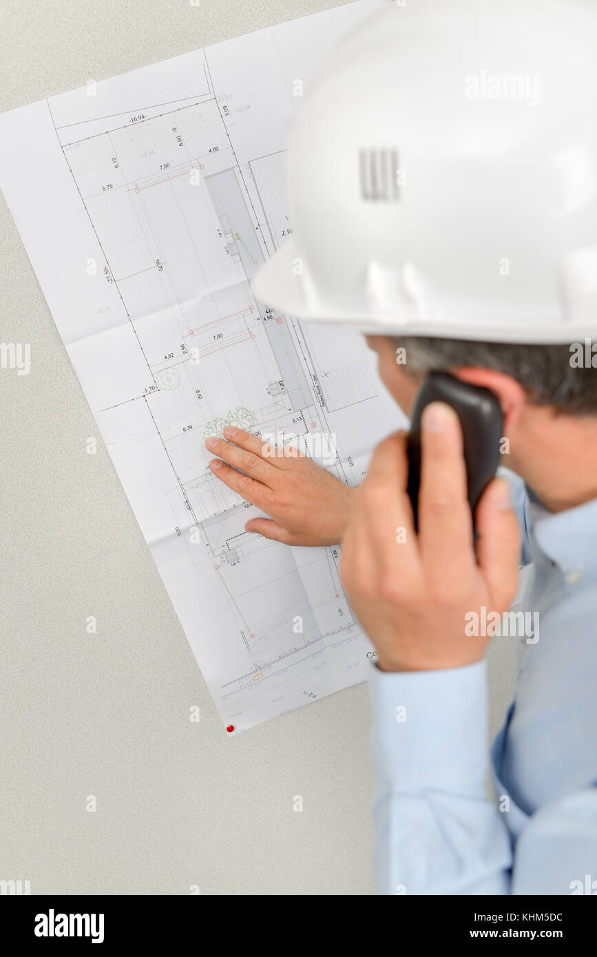 Architect calling his workers Stock Photo - Alamy