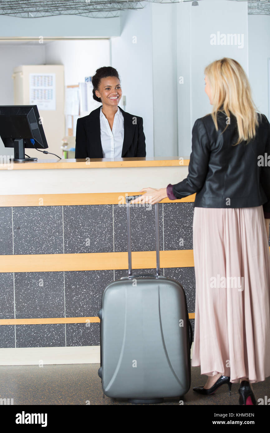doing check-in at the hotel Stock Photo - Alamy