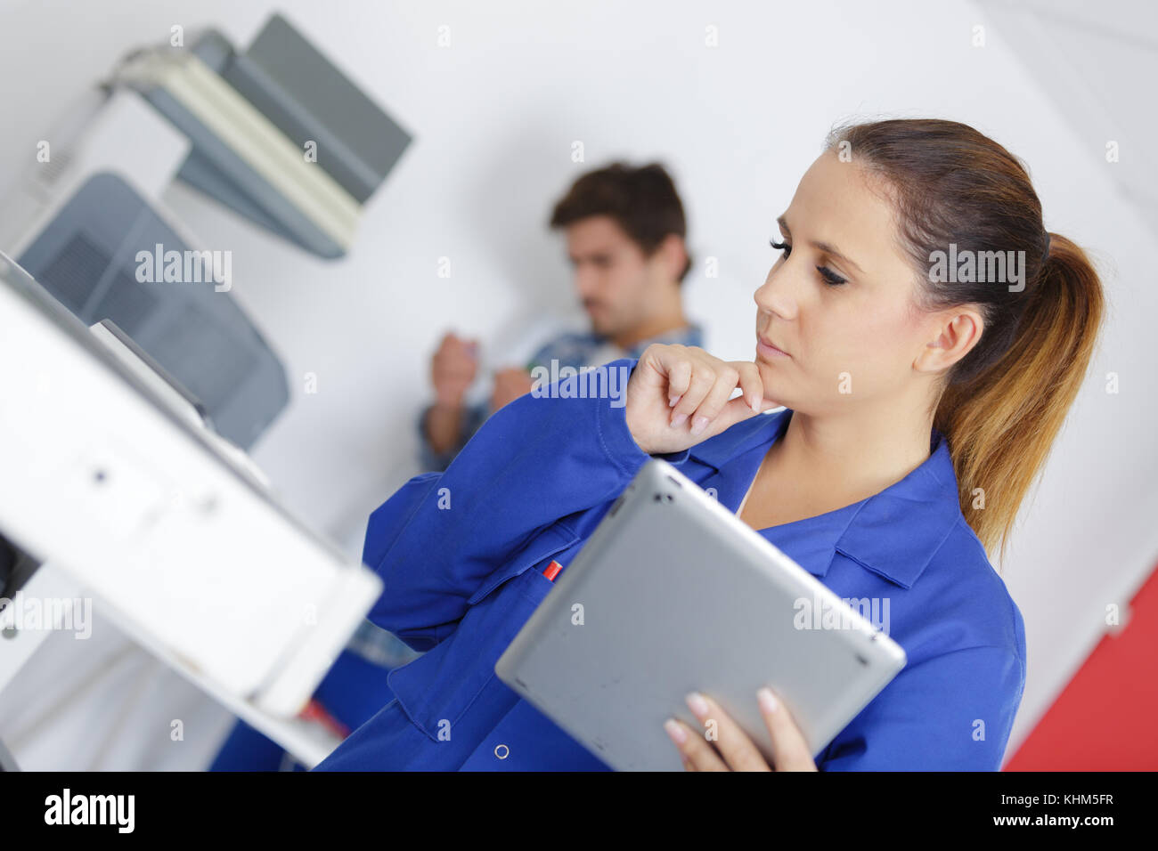 young digital gadget technician Stock Photo - Alamy