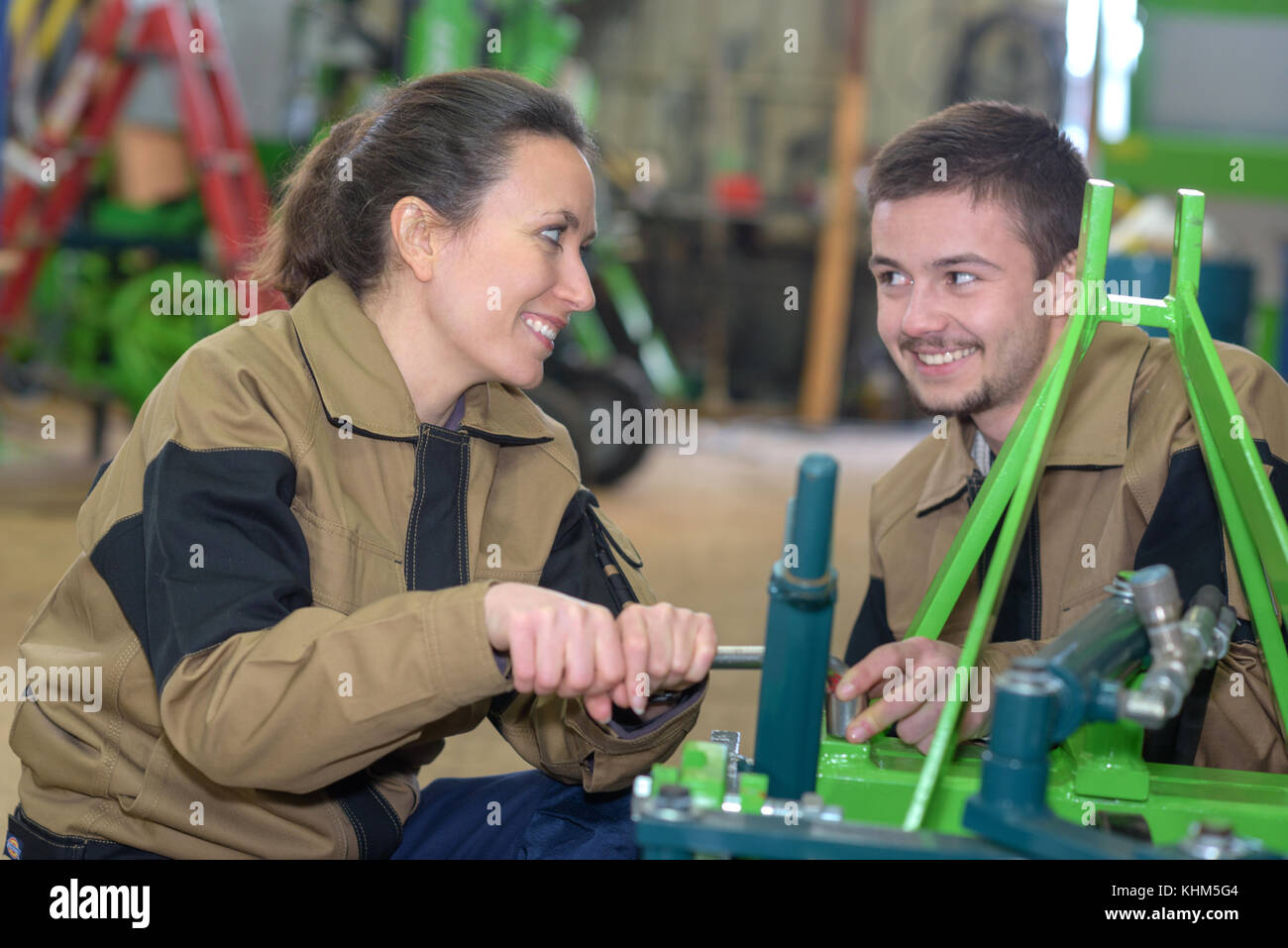 employees using industrial machinery at factory Stock Photo - Alamy