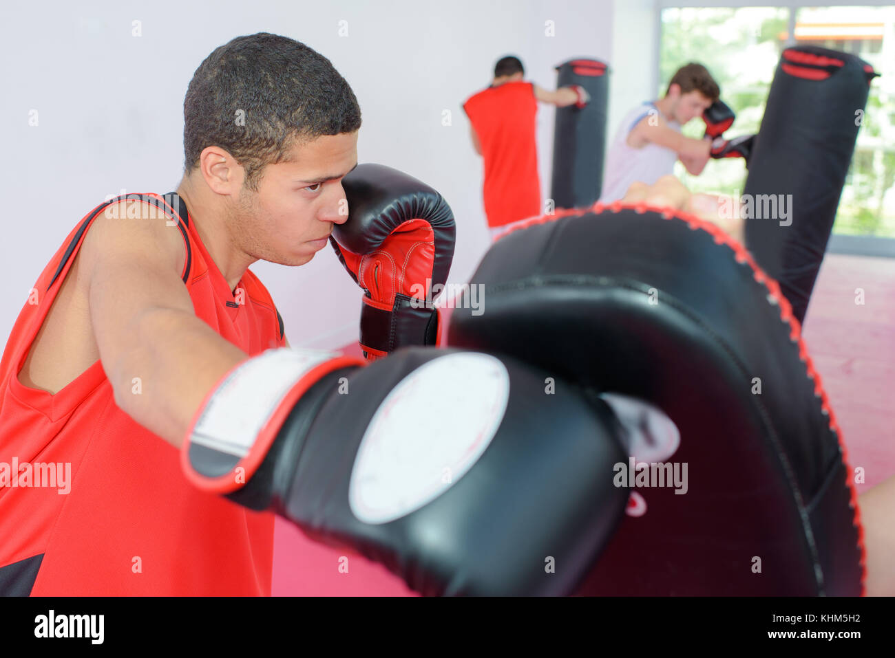 Young man in boxing training Stock Photo - Alamy