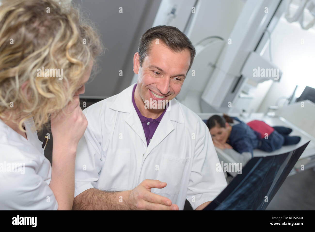 Male patient laughing female doctor hi-res stock photography and images ...