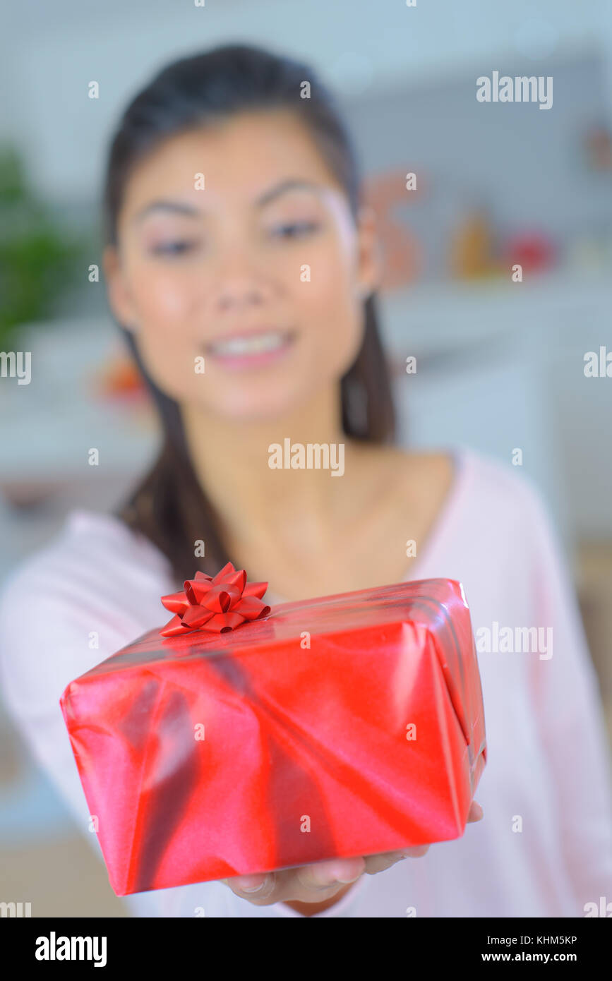 woman holding a present Stock Photo - Alamy