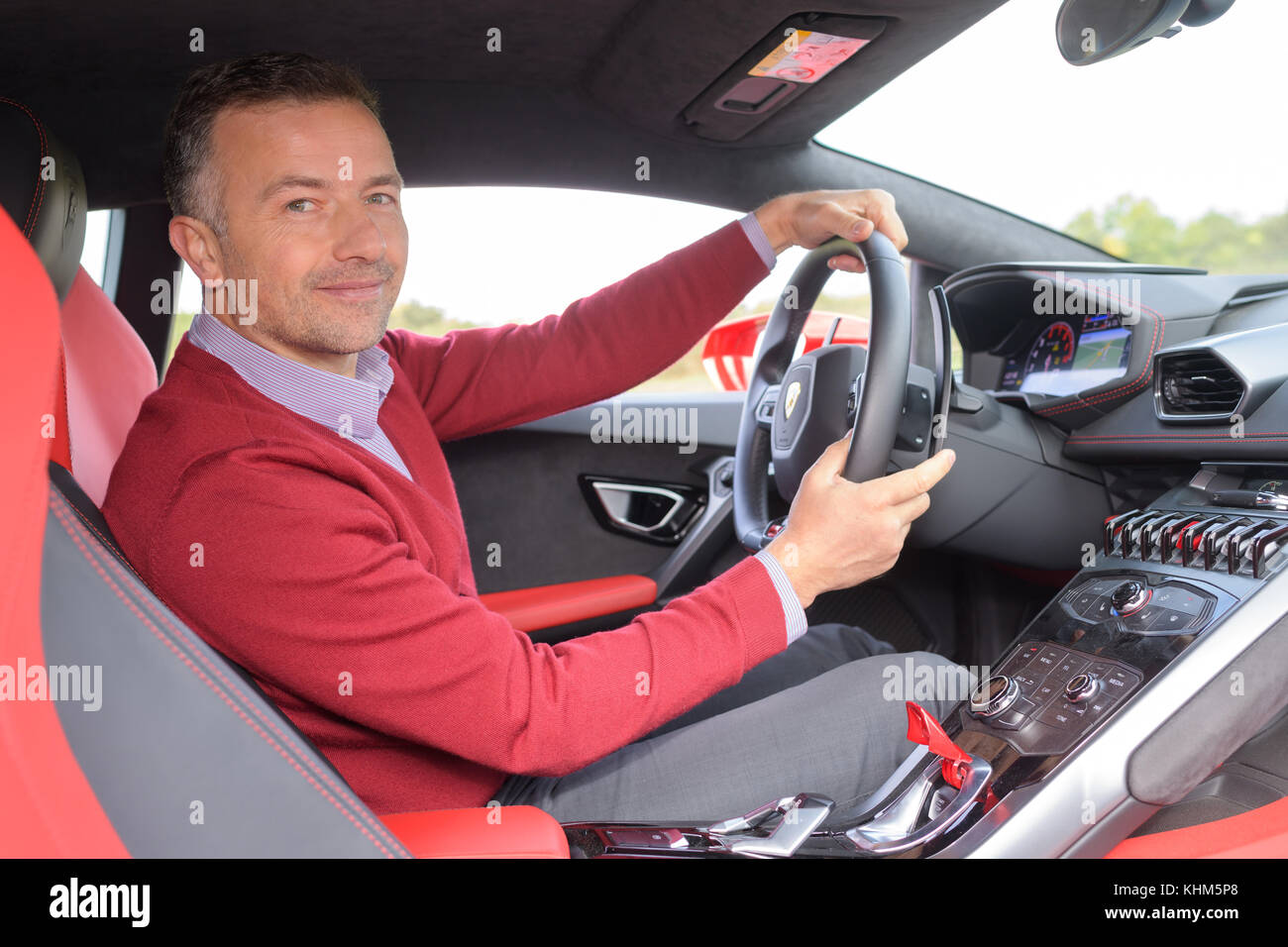 happy man driving an expensive car Stock Photo - Alamy