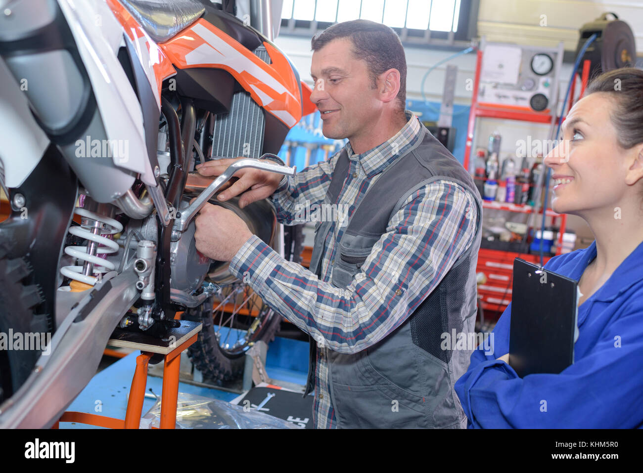 Female Mechanic Working On Motorcycle Stock Photos & Female Mechanic ...