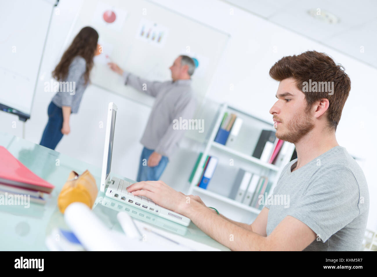 young man using laptop to learn english Stock Photo - Alamy